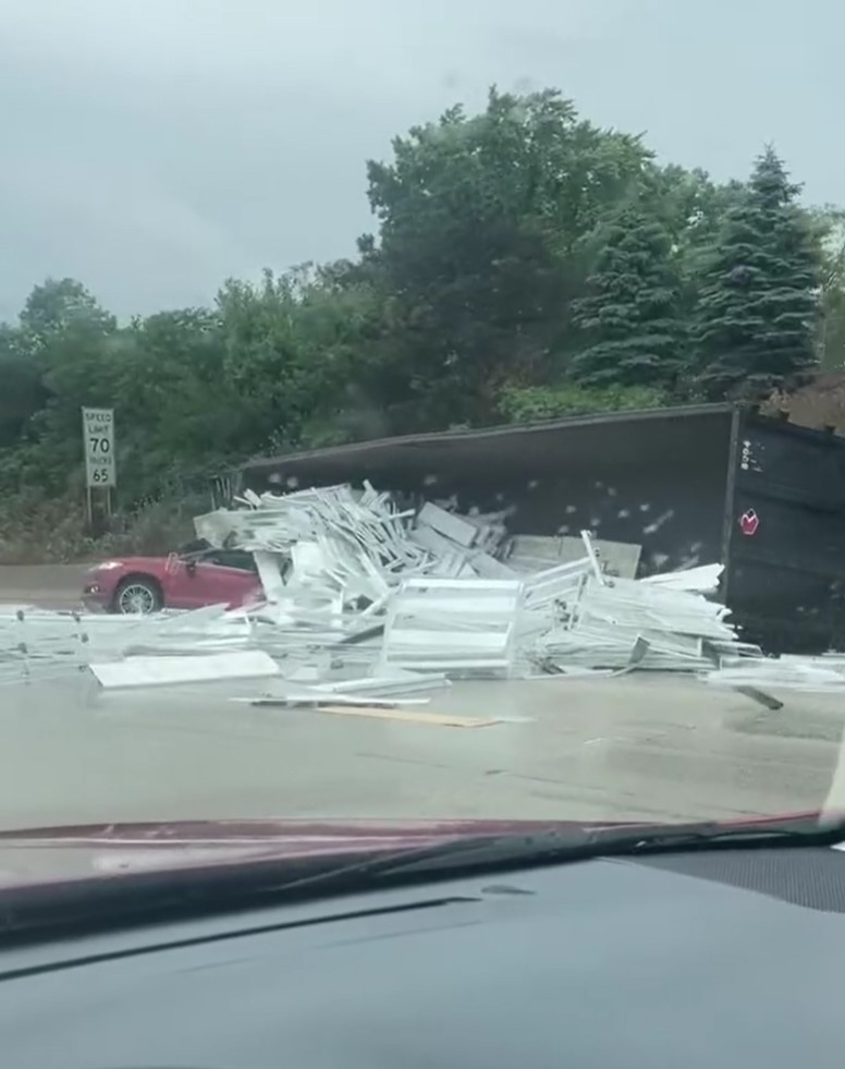 Rolled semi-truck crash closes westbound I-696 at Hoover | FOX 2 Detroit